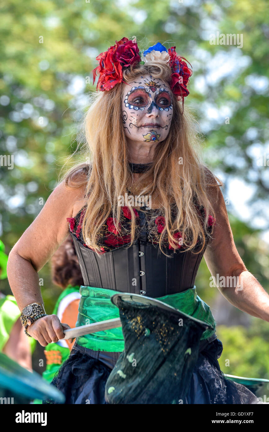 A woman with whimsical makeup and costume, at the yearly "Summer ...