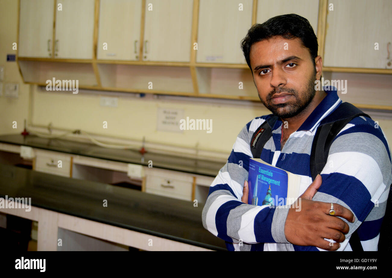 Indian University student standing in there Laboratory Stock Photo - Alamy