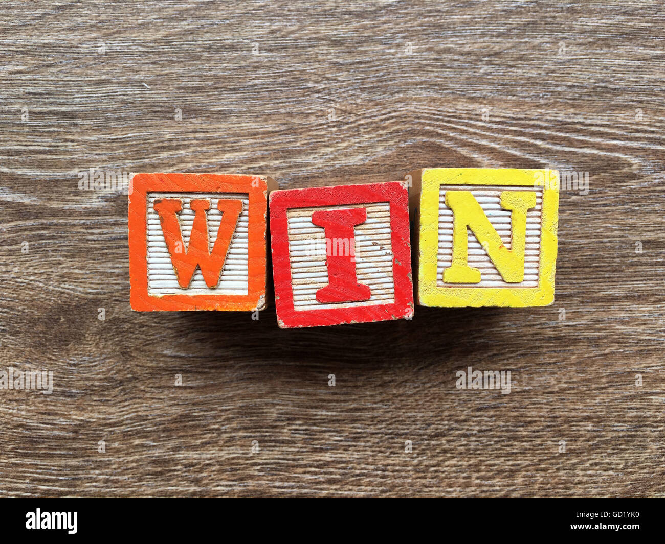 WIN word done with wood block letter toys Stock Photo - Alamy