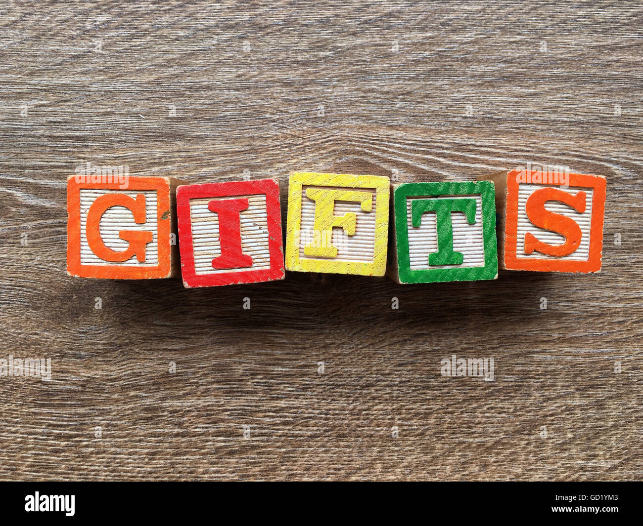 GIFTS word written with wood block letter toys Stock Photo - Alamy