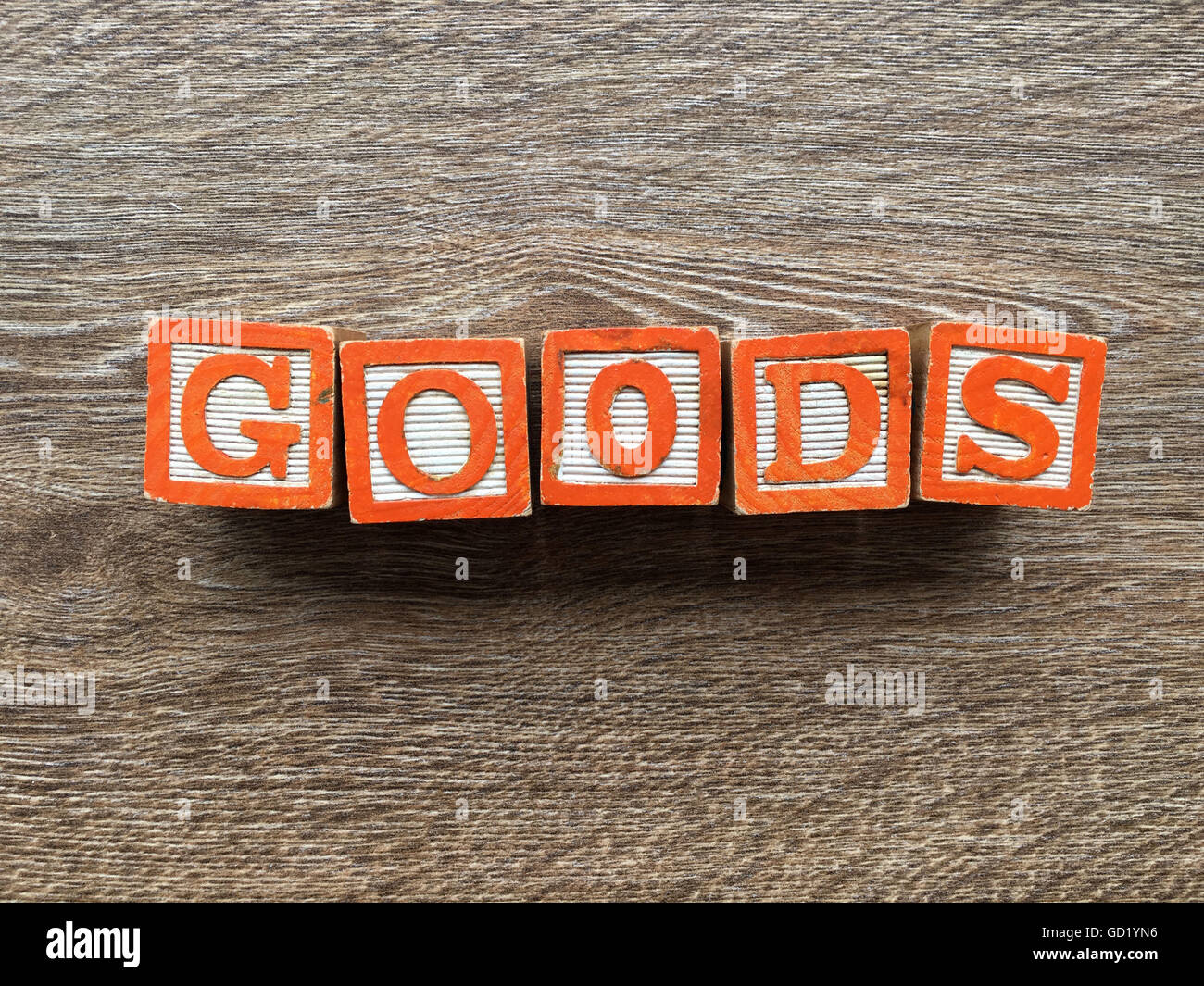 GOODS word written with wood block letter toys Stock Photo - Alamy