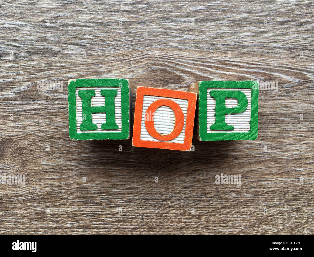 HOP word written with wood block letter toys Stock Photo - Alamy