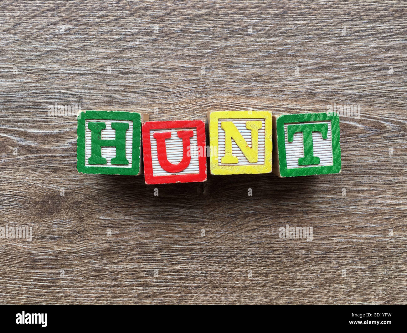HUNT word written with wood block letter toys Stock Photo - Alamy