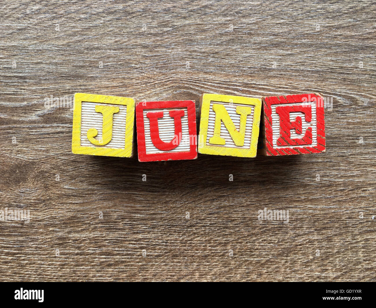 JUNE word done with wood blocks letters toyy. It's th month of june in ...