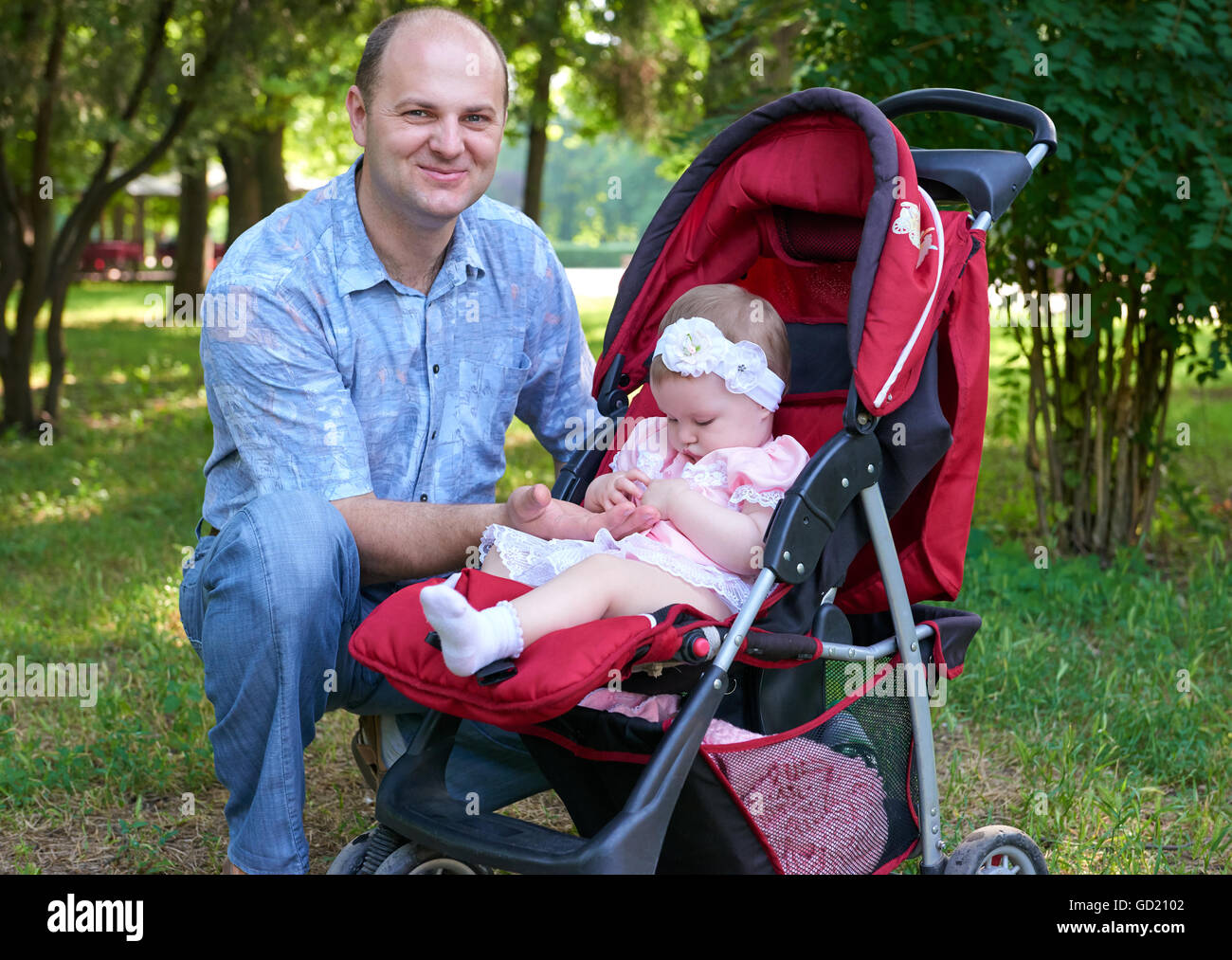 Happy father with baby girl portrait in city park hi-res stock ...