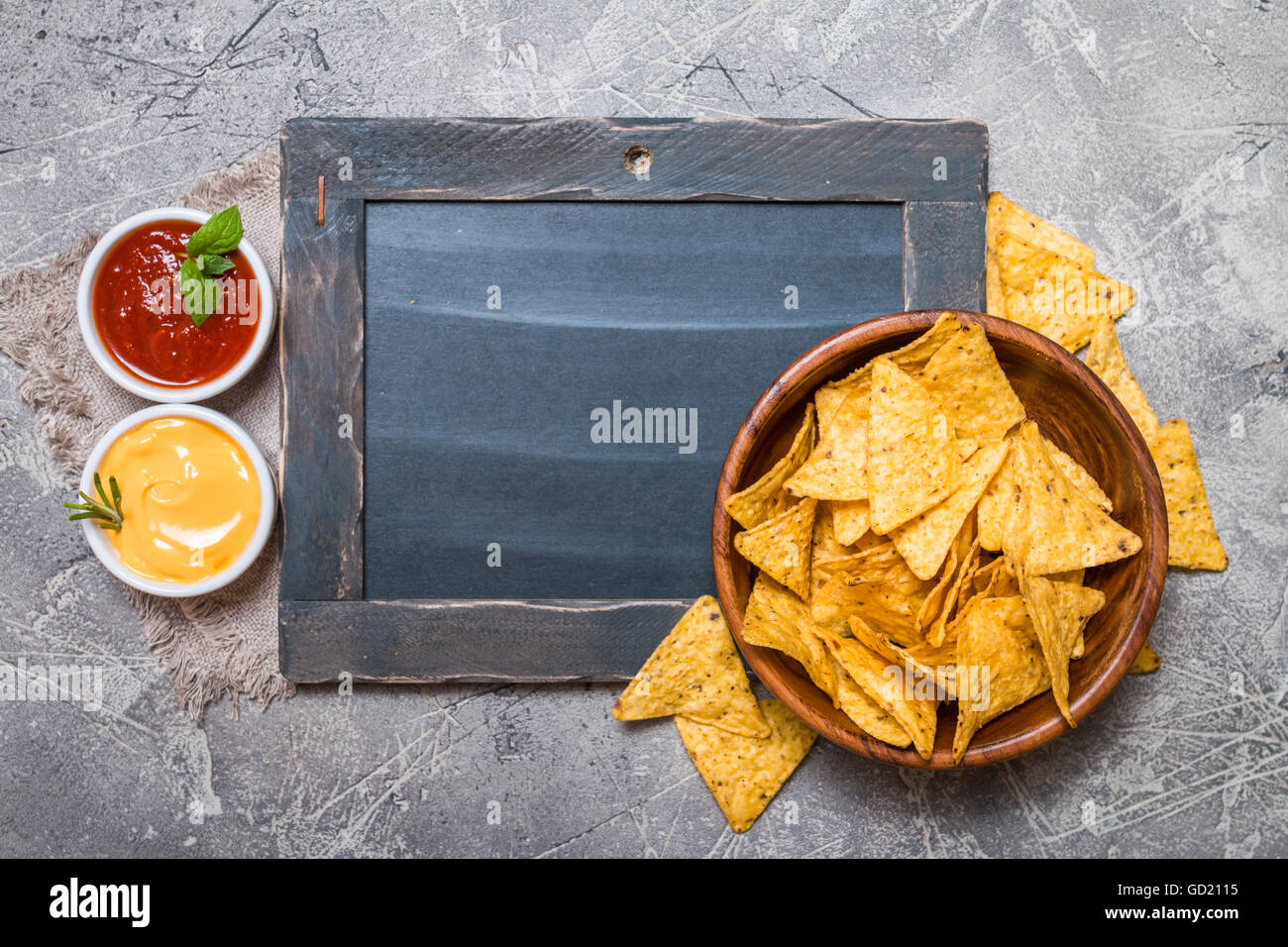Mexican nacho with sauces and chalk board on gray background, top view ...