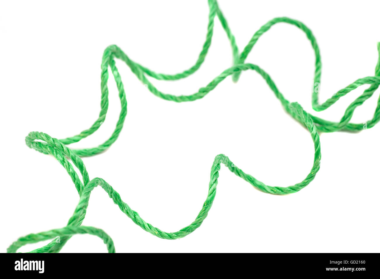 Rope in the form of waves isolated on white Stock Photo - Alamy