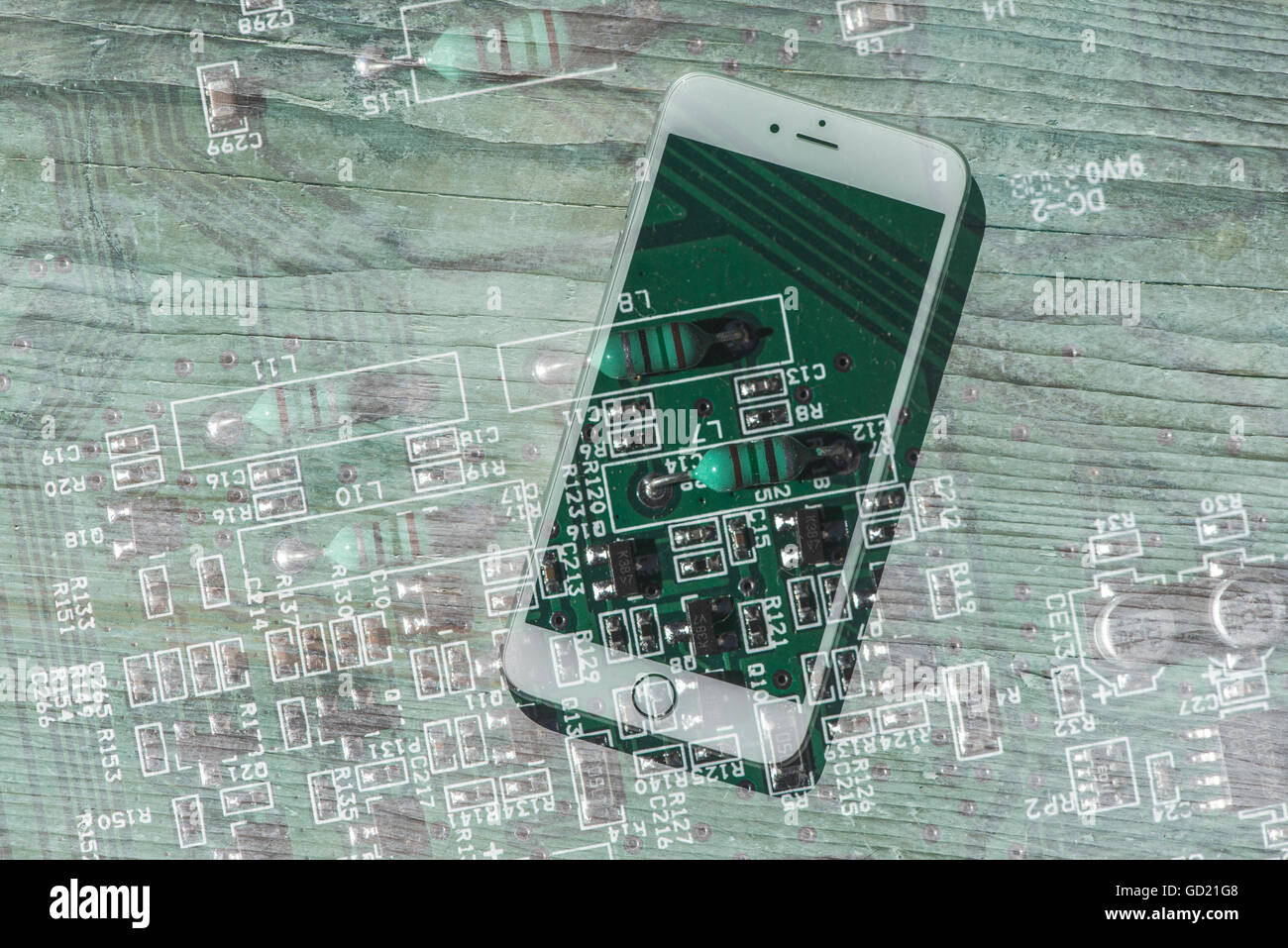 Smartphone and computer board blended Stock Photo - Alamy