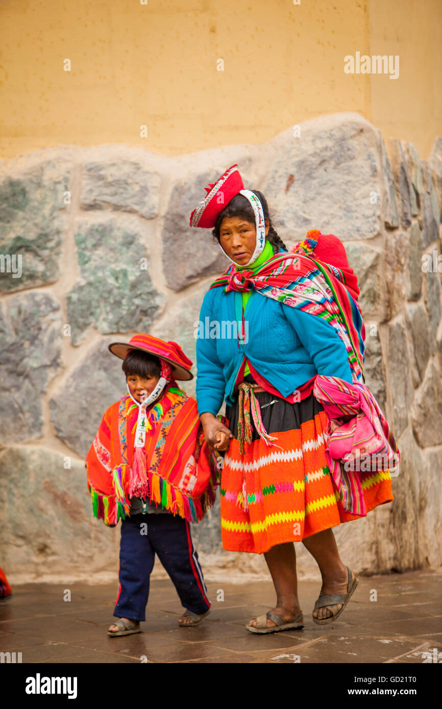 Traditional Peruvian Incan woman and her son, Ollantaytambo, Peru ...