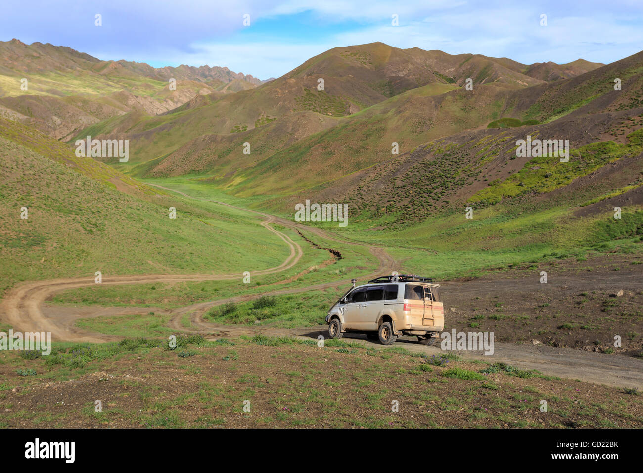 Vehicle travels off road through lush mountains, Gurvan Saikhan ...