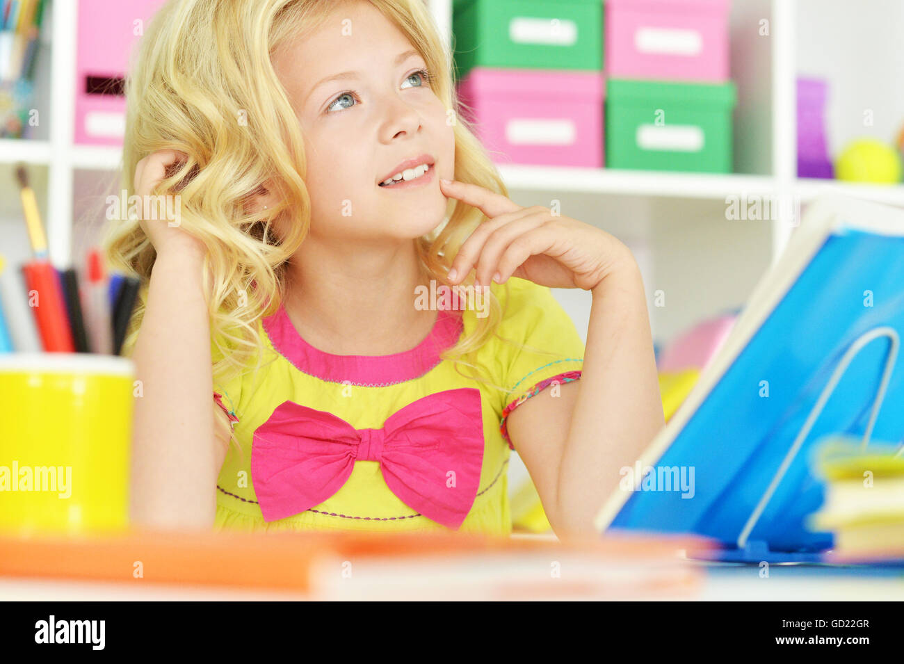 Little girl drawing at class Stock Photo - Alamy
