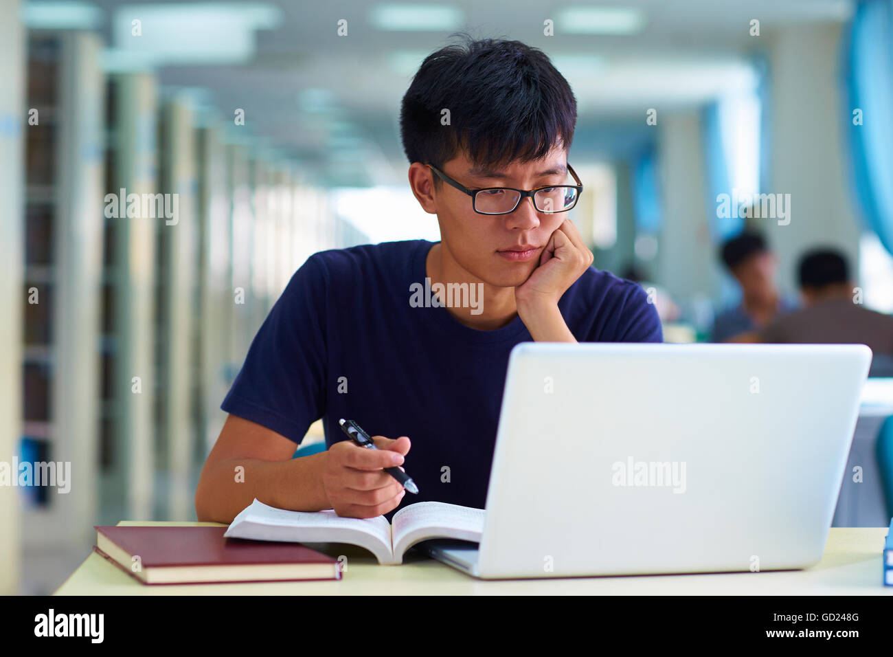 one college student study in the library with laptop Stock Photo - Alamy