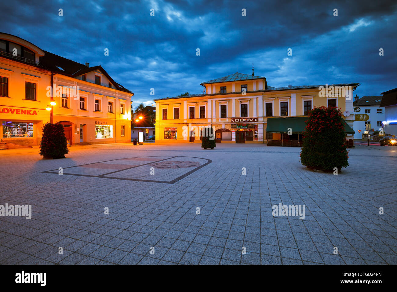 Main square of Dolny Kubin late in the evening Stock Photo - Alamy