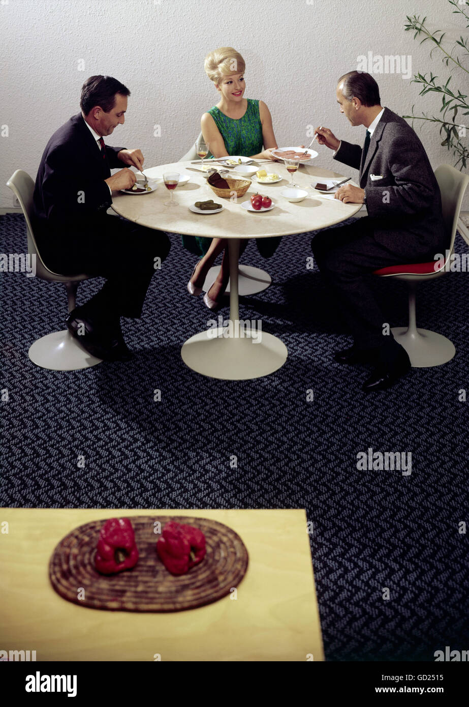 people, eating and drinking, woman with guests sitting at dinner table ...
