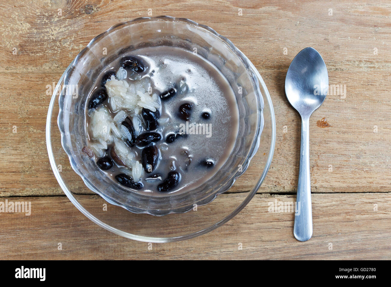 Sweet Sticky Rice and Black Beans in Coconut Milk. Thai dessert on wood ...