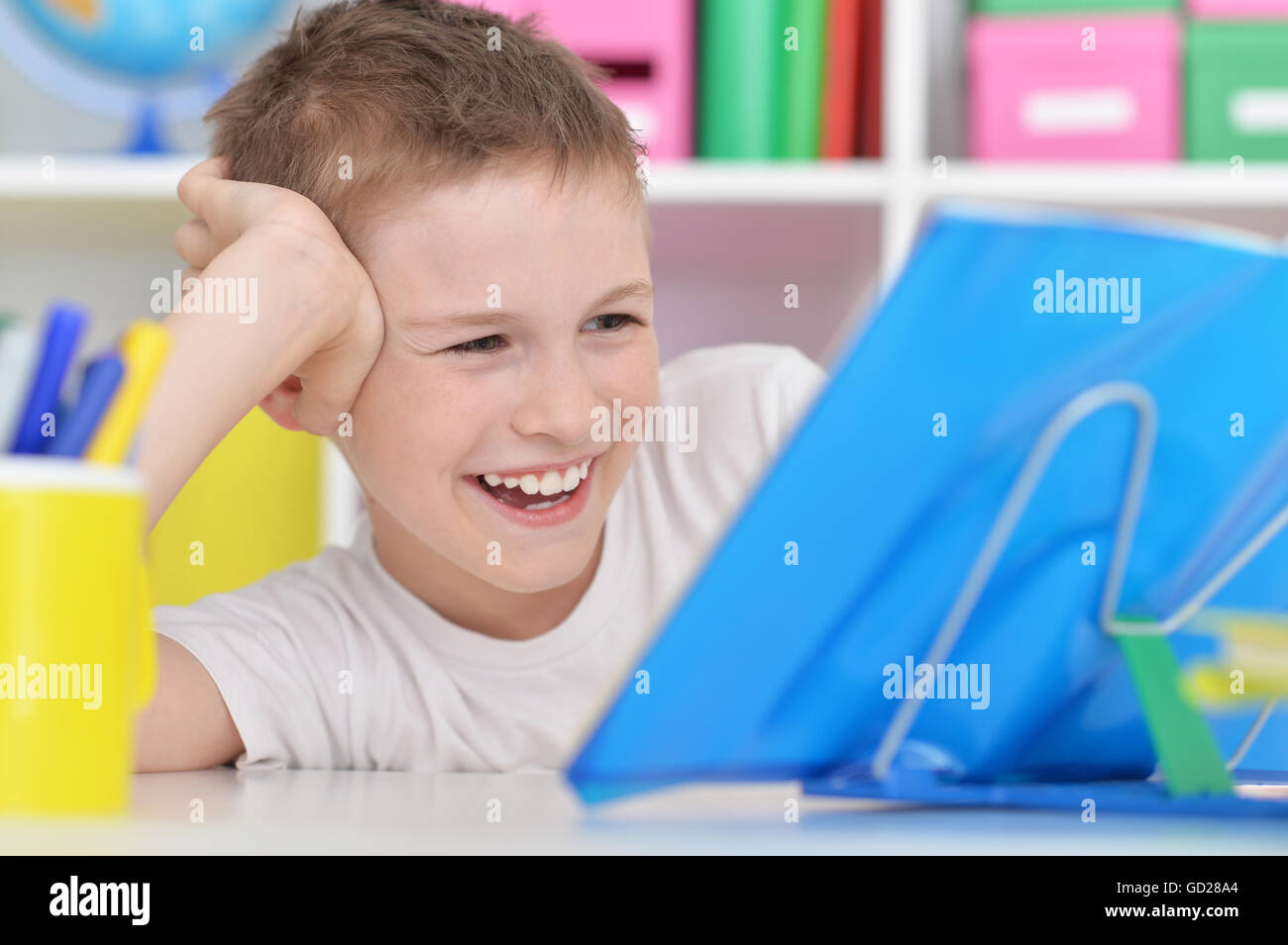 cute boy reading book Stock Photo - Alamy