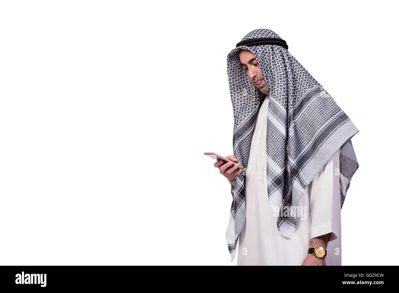 Arab man with his mobile phone isolated on white Stock Photo - Alamy