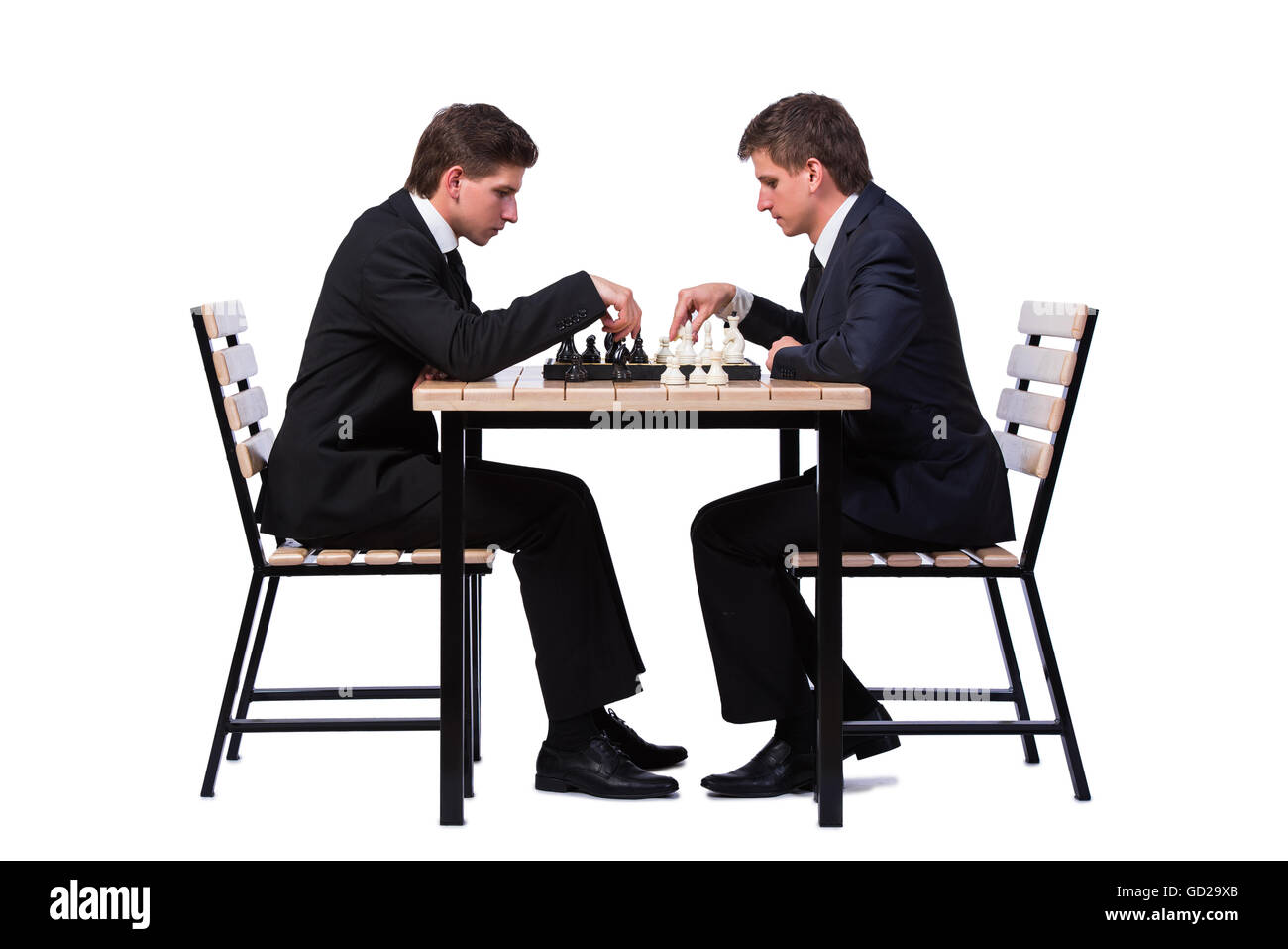 Twin brothers playing chess isolated on white Stock Photo - Alamy