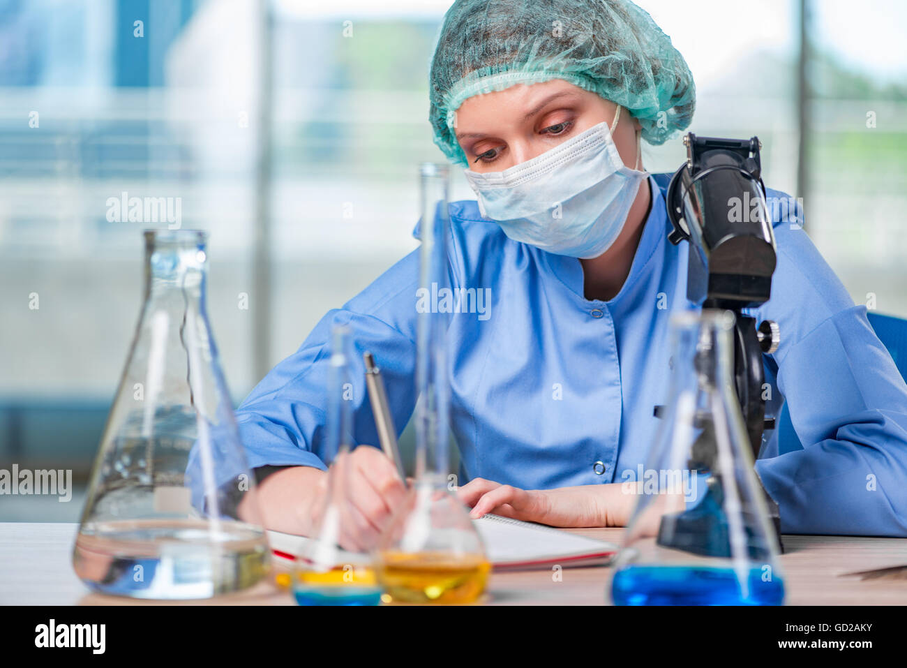 Experienced lab assistant working on chemical solutions Stock Photo - Alamy