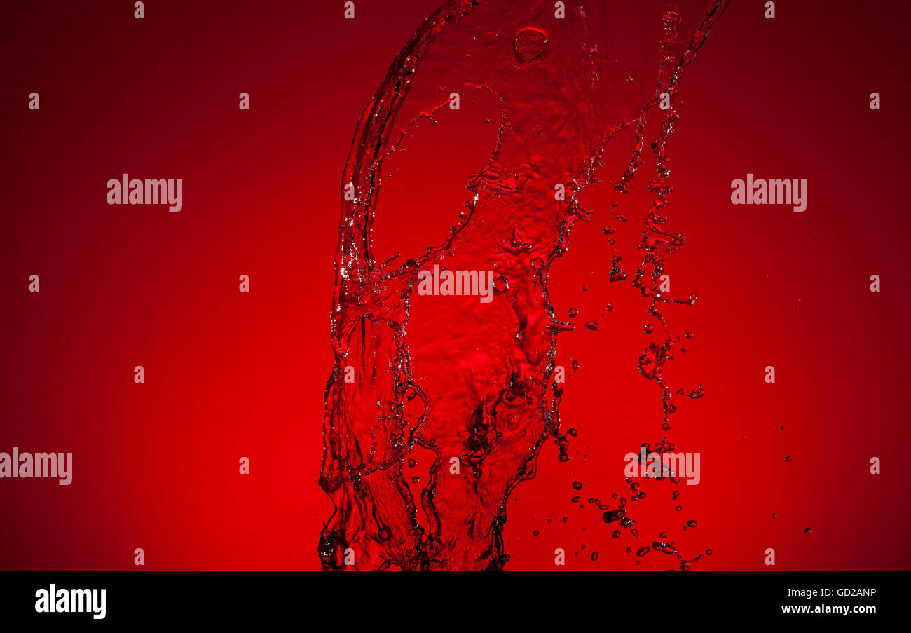 Waterfall on a red background Stock Photo - Alamy