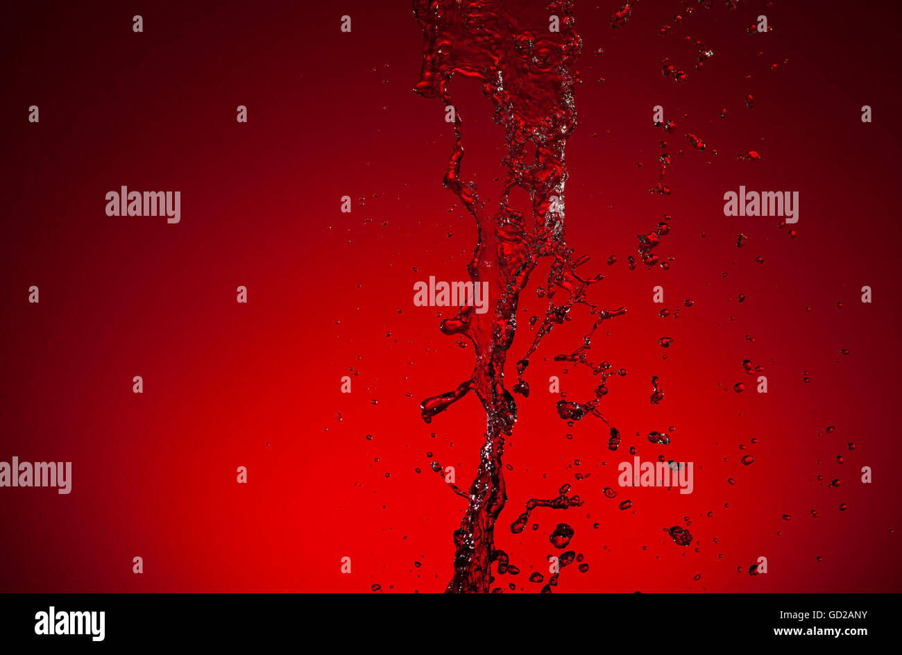 Water droplets on a red background Stock Photo - Alamy