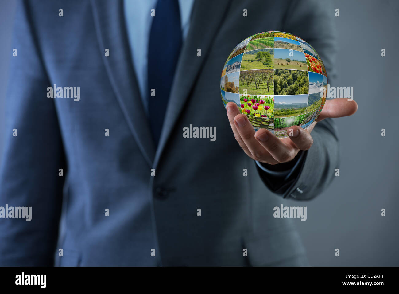 Man holding earth with nature photos Stock Photo - Alamy