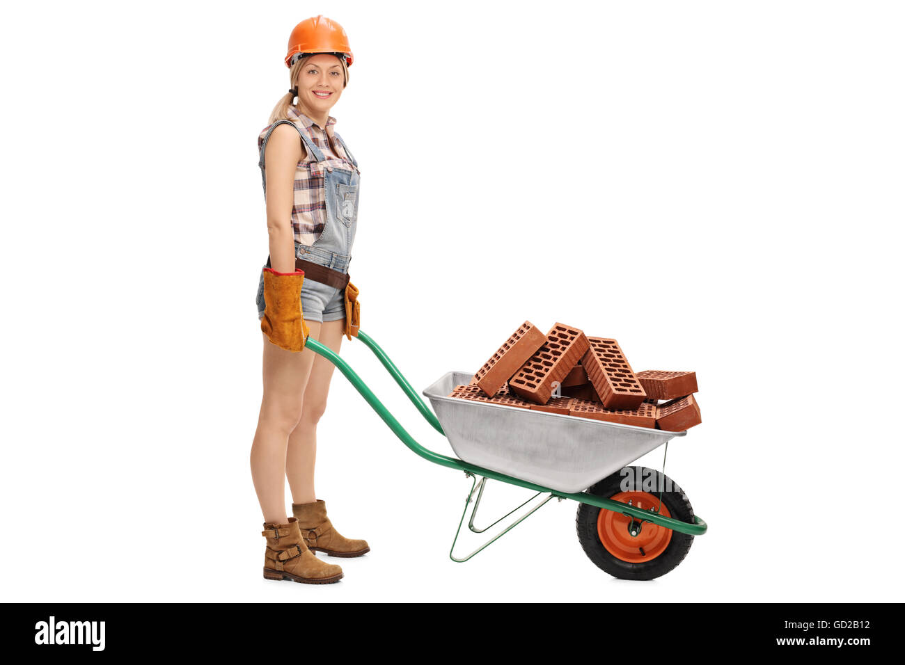 Woman pushing a wheelbarrow Cut Out Stock Images & Pictures - Alamy