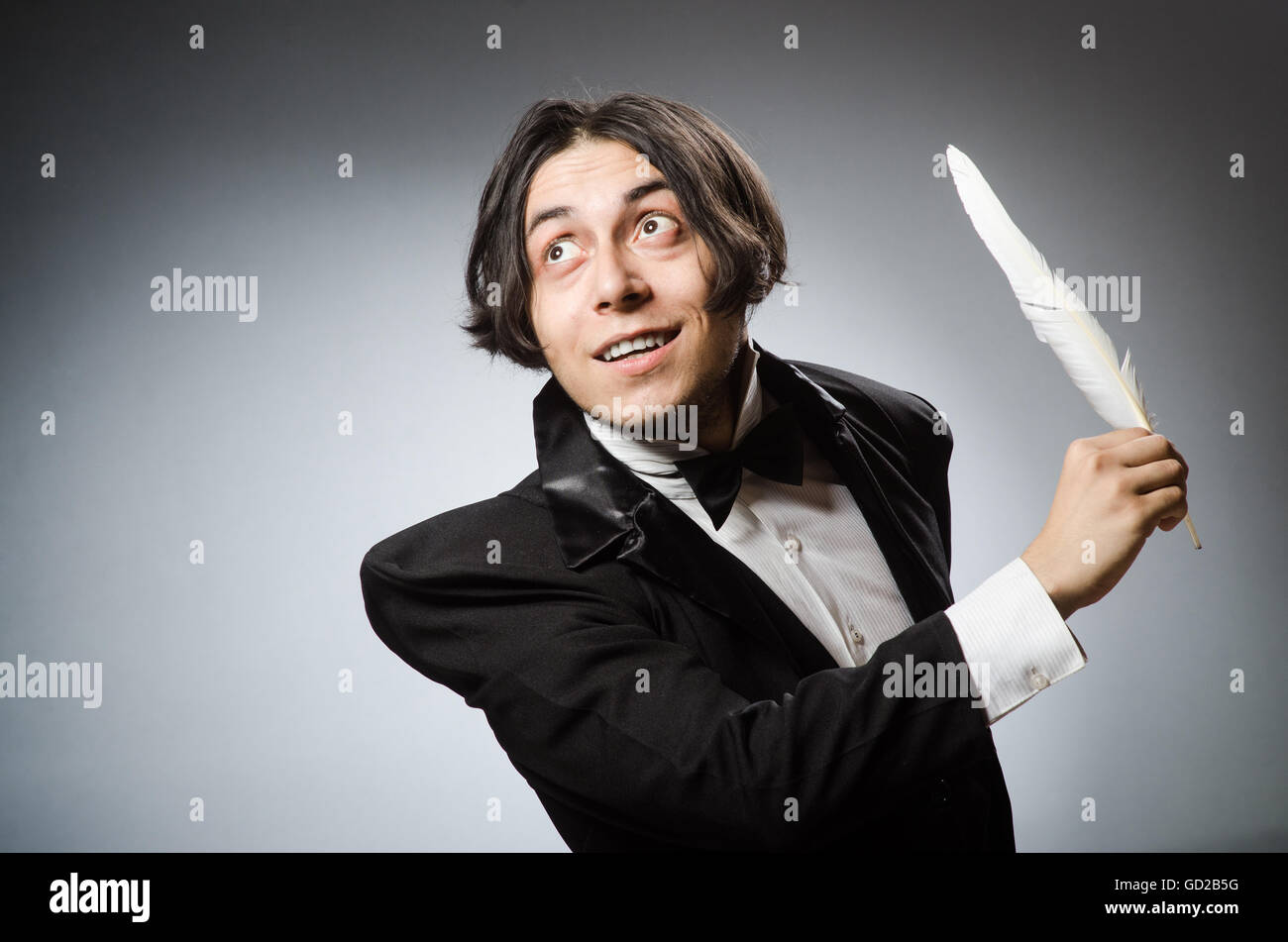 Funny writer with quill in vintage concept Stock Photo - Alamy