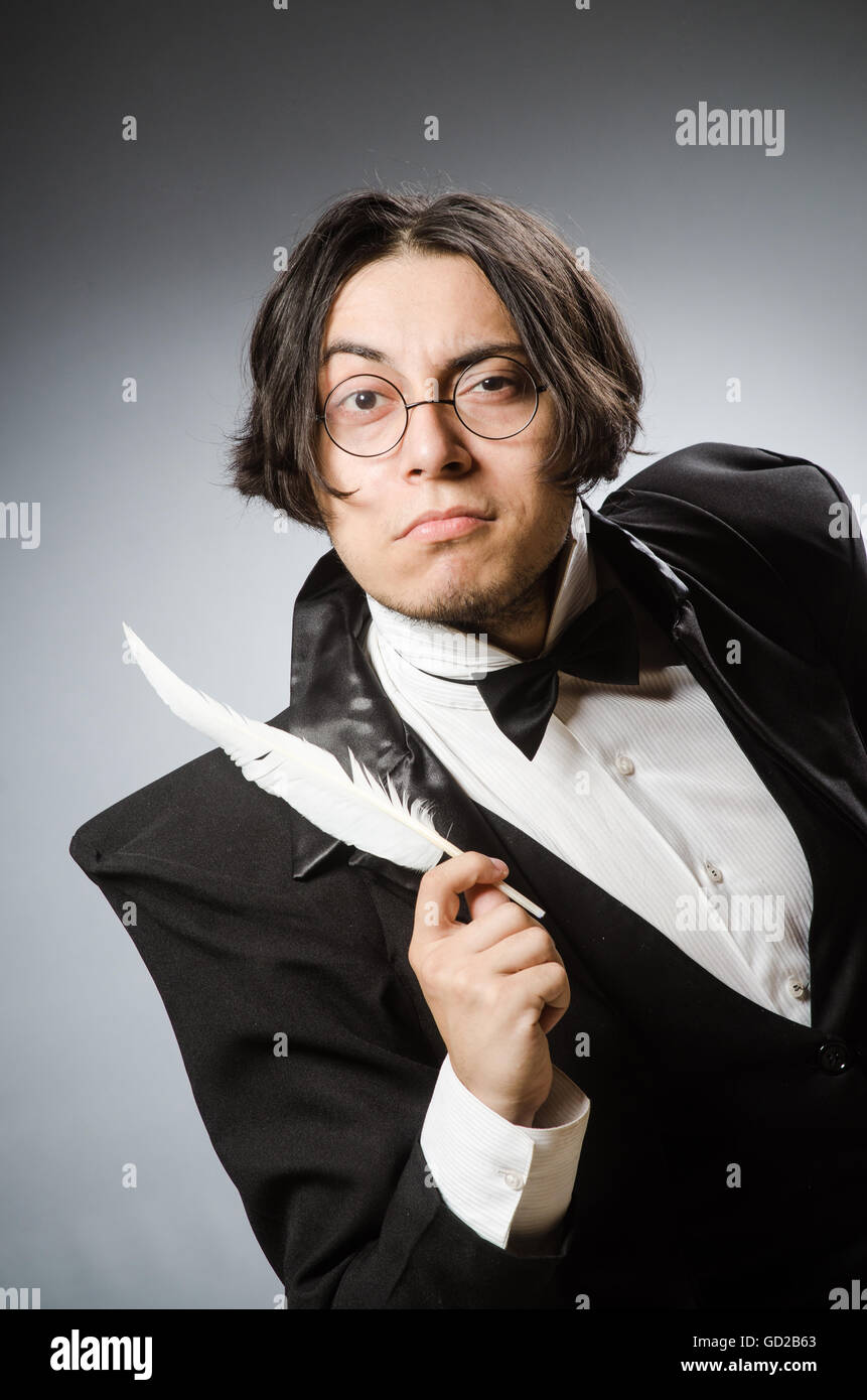 Funny writer with quill in vintage concept Stock Photo - Alamy