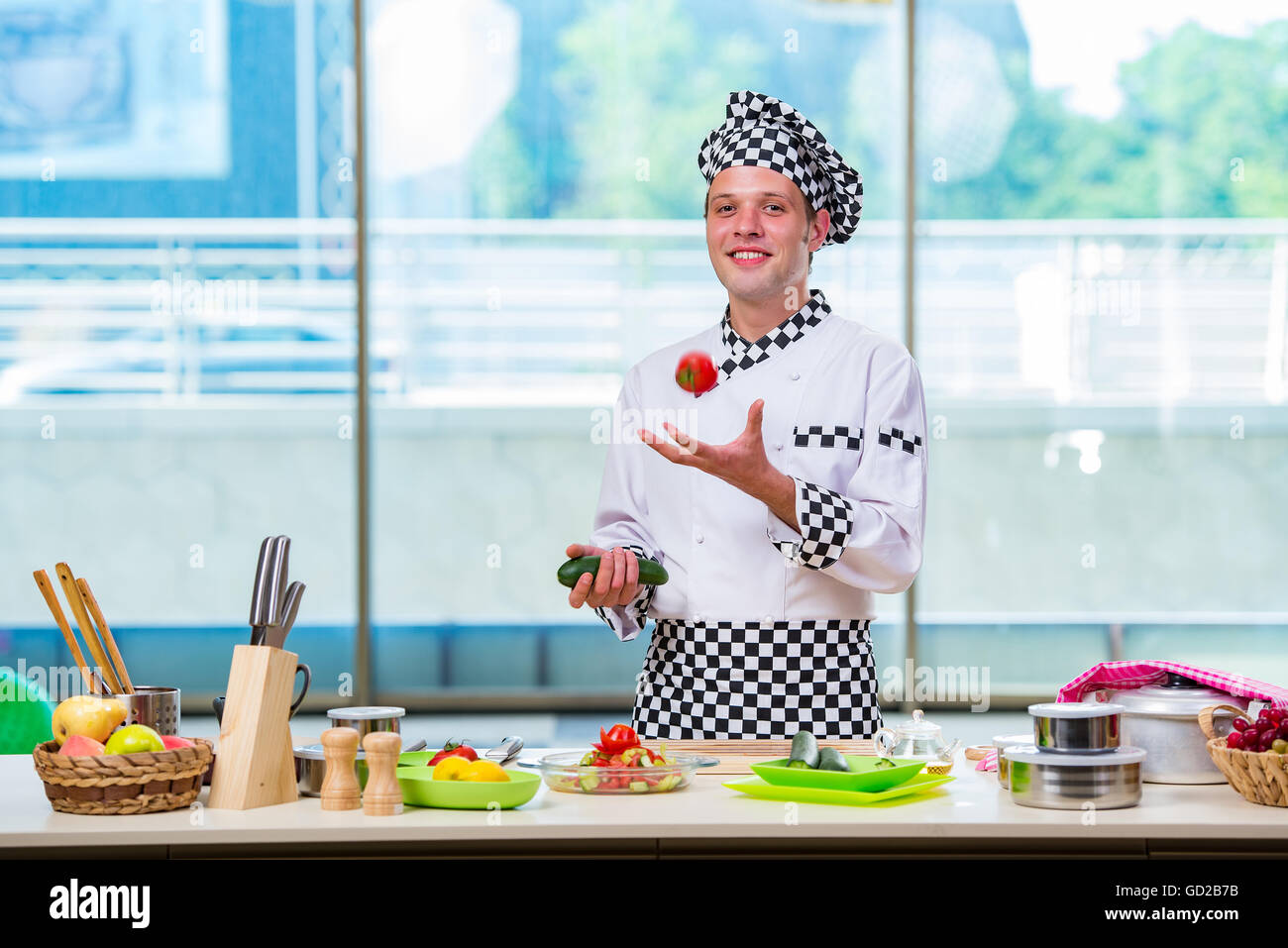 Male cook preparing food in the kitchen Stock Photo - Alamy