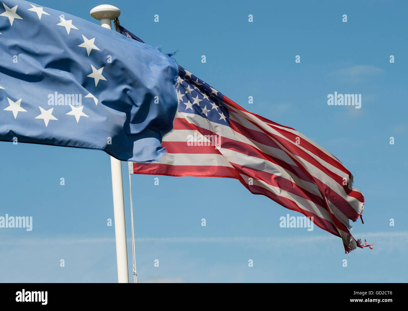 EU and USA flags blowing in the wind with blue sky background. Flags ...