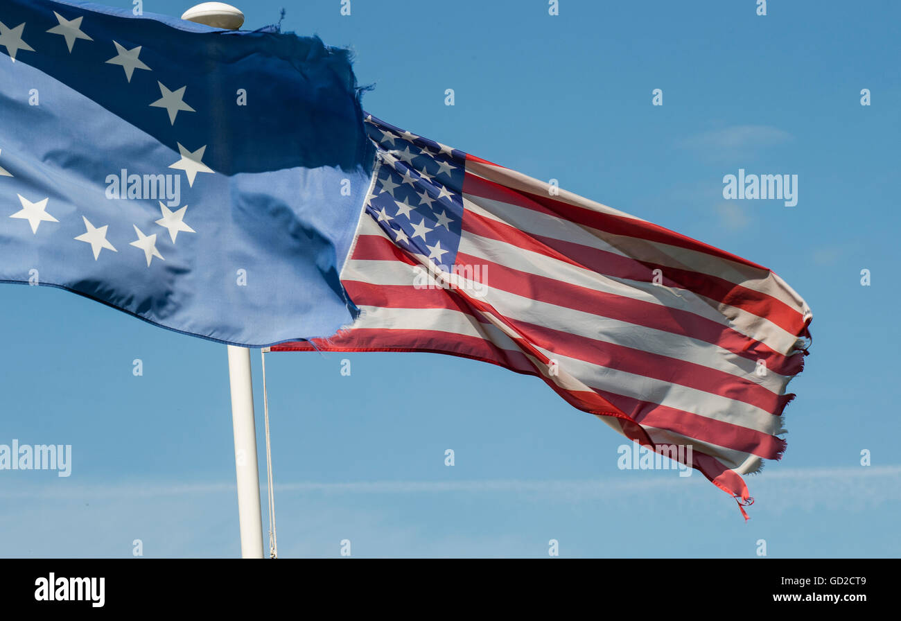 EU and USA flags blowing in the wind with blue sky background. Flags ...
