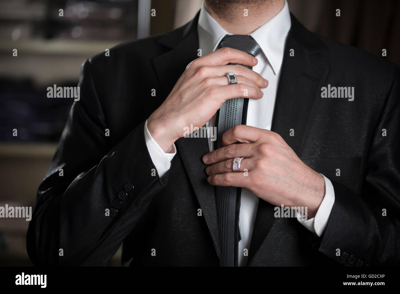 Fixing the tie hi-res stock photography and images - Alamy