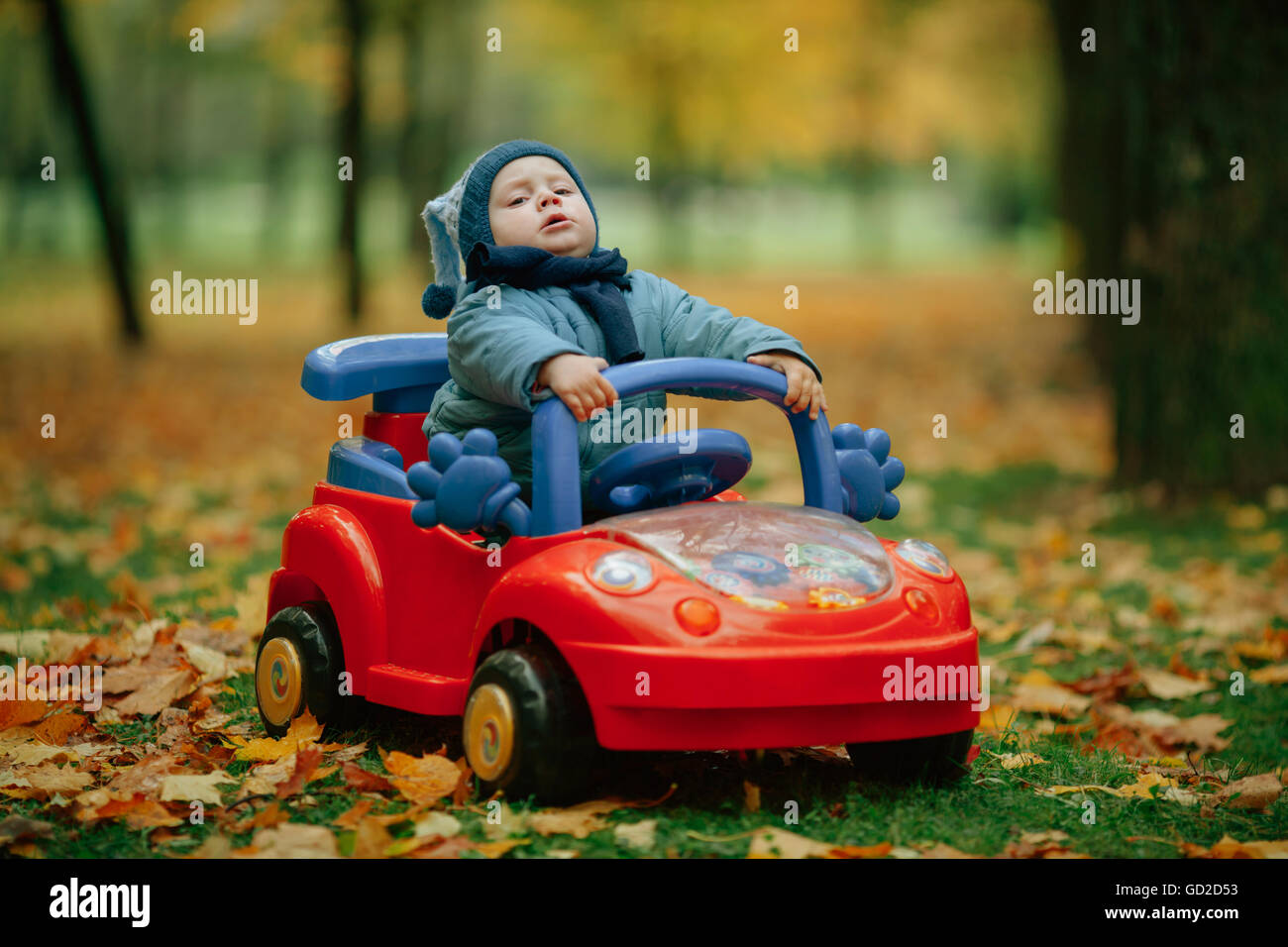little funny boy driving toy car Stock Photo - Alamy