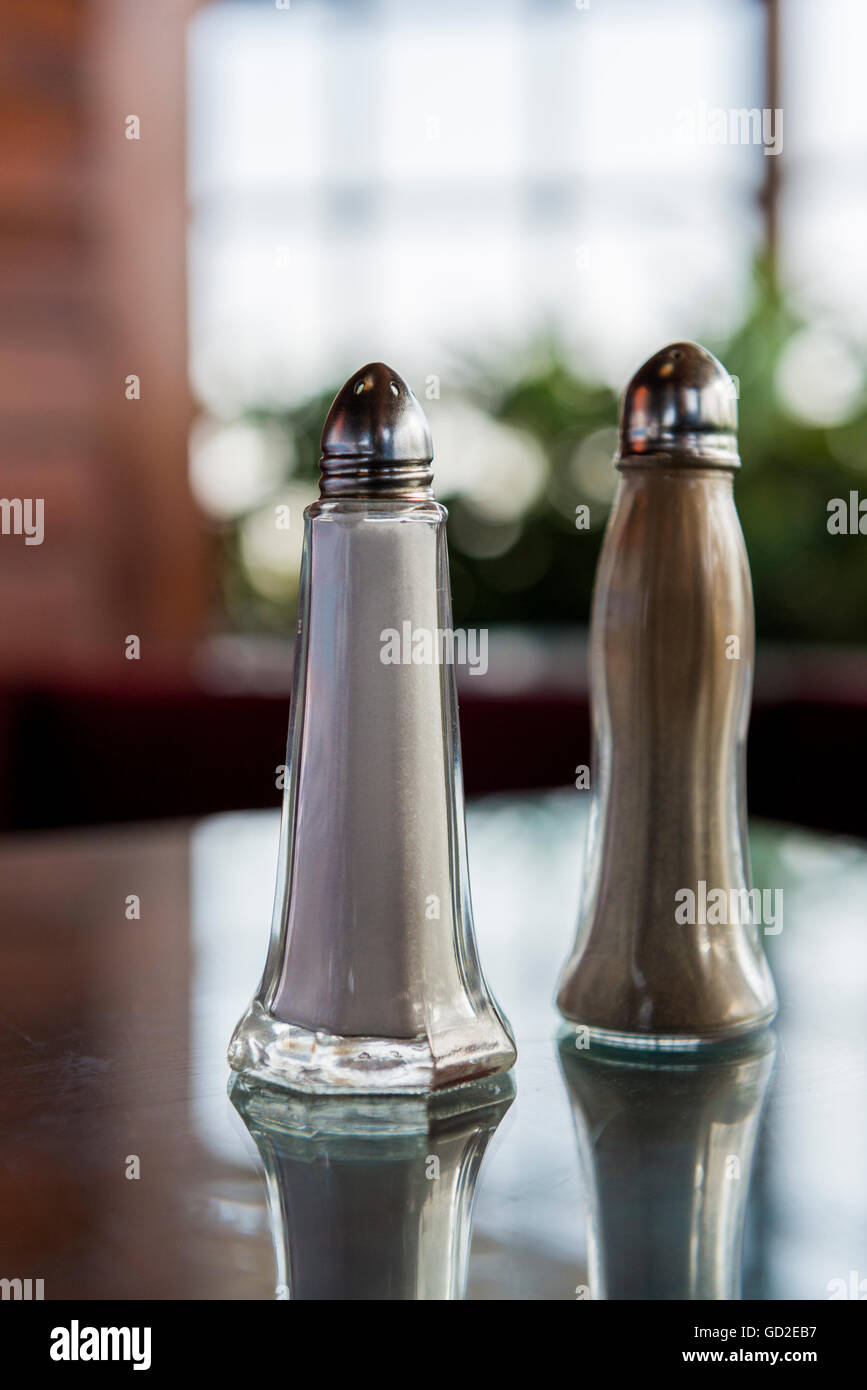 Salt and Pepper Shakers on a Restaurant Tabletop Stock Photo - Alamy