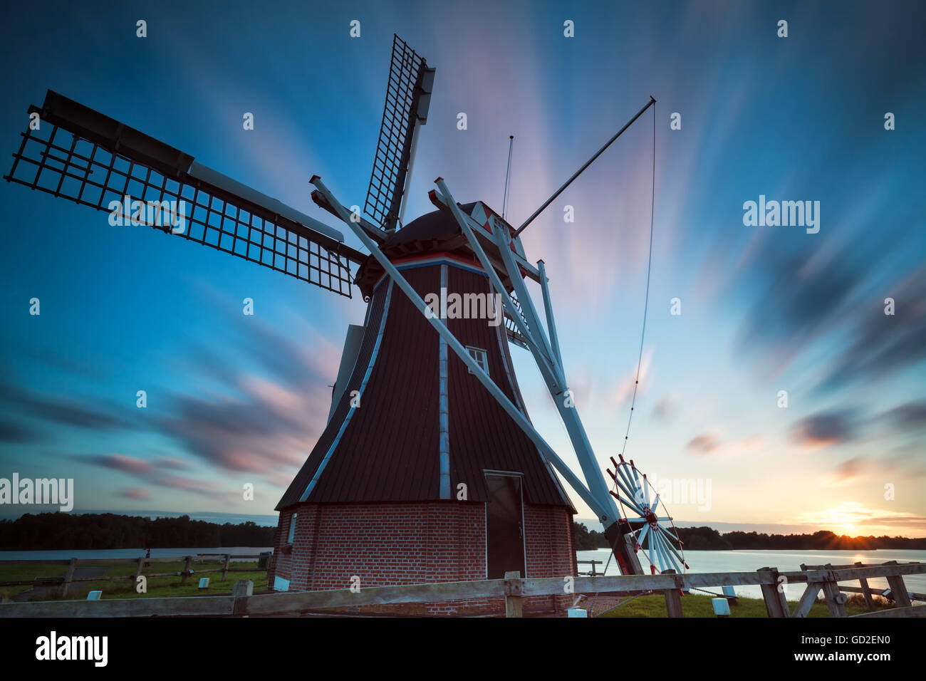 windmill at sunset via wide angle with long exposure, Holland Stock ...