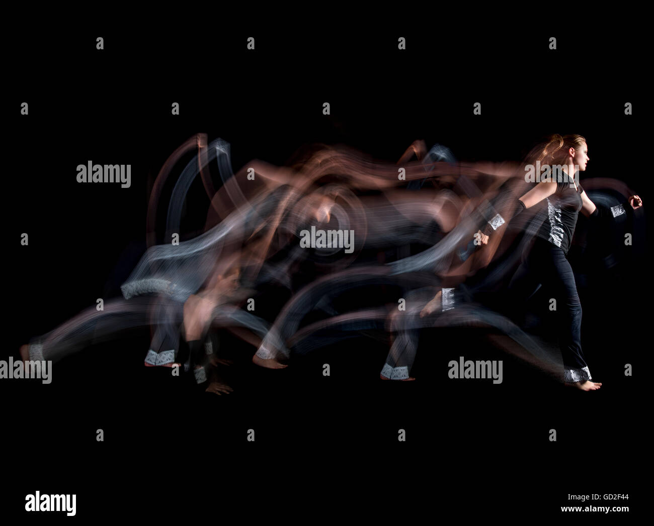 dancer woman running light movement blur Stock Photo - Alamy