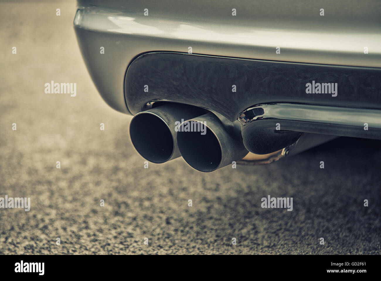 Double exhaust pipes of a modern sports car Stock Photo - Alamy