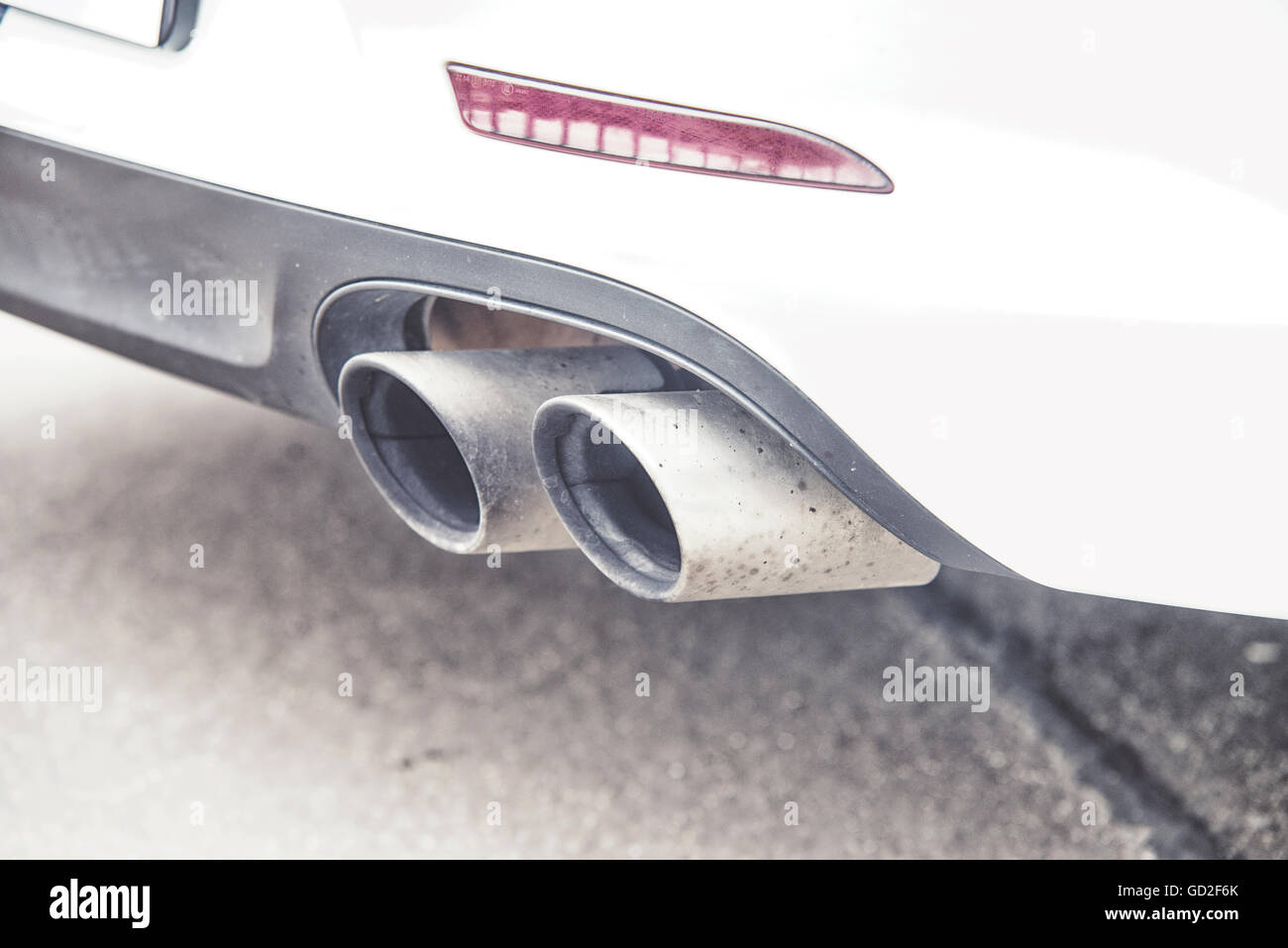 Double exhaust pipes of a modern sports car Stock Photo - Alamy
