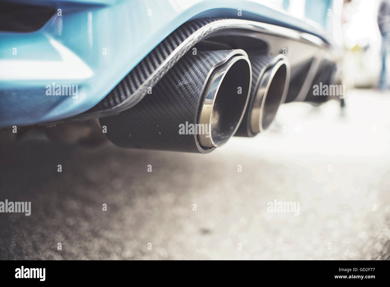 Double exhaust pipes of a modern sports car Stock Photo - Alamy