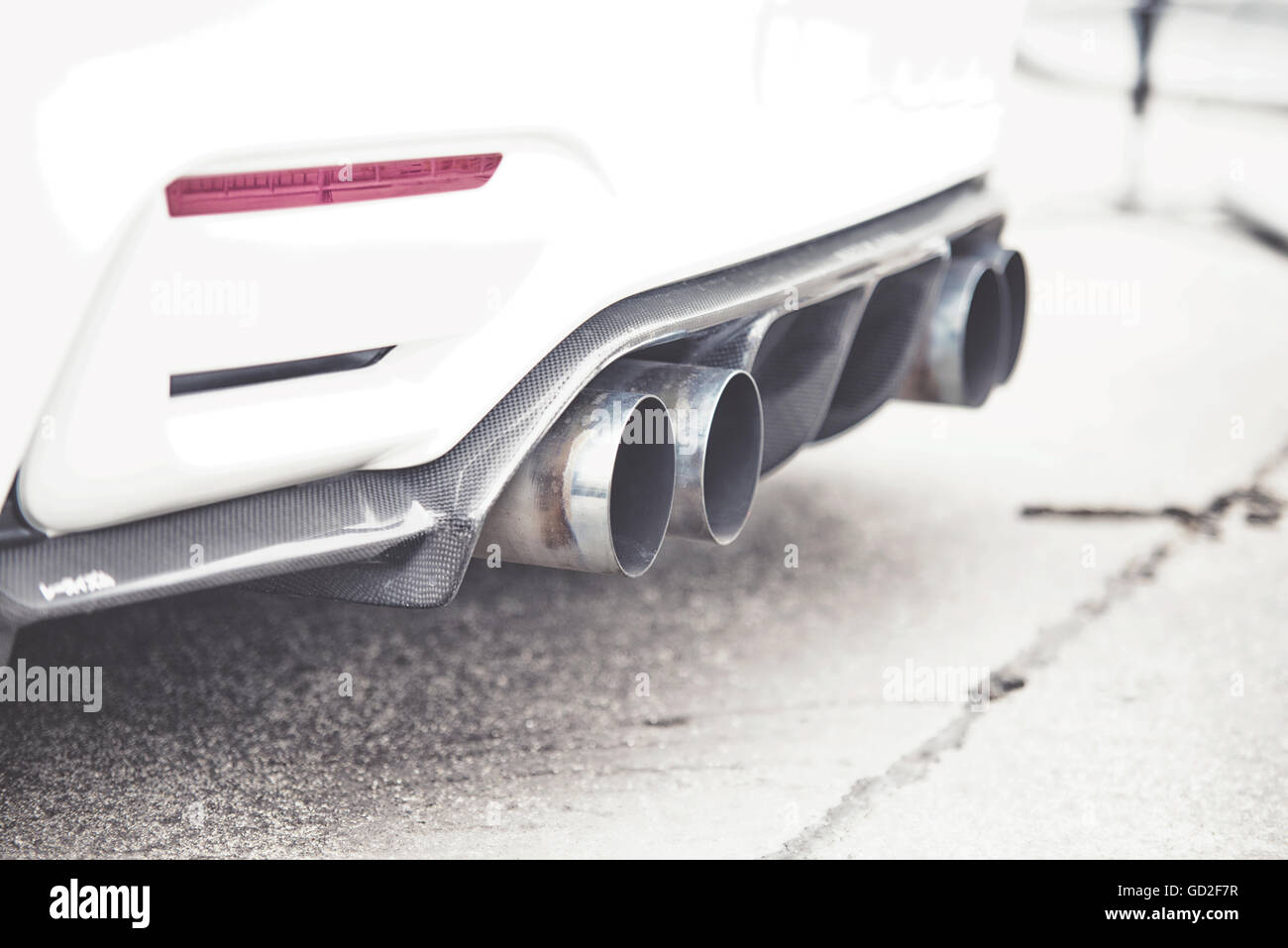 Double exhaust pipes of a modern sports car Stock Photo - Alamy
