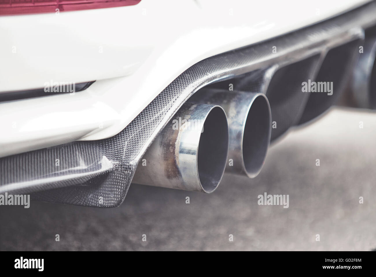 Double exhaust pipes of a modern sports car Stock Photo - Alamy