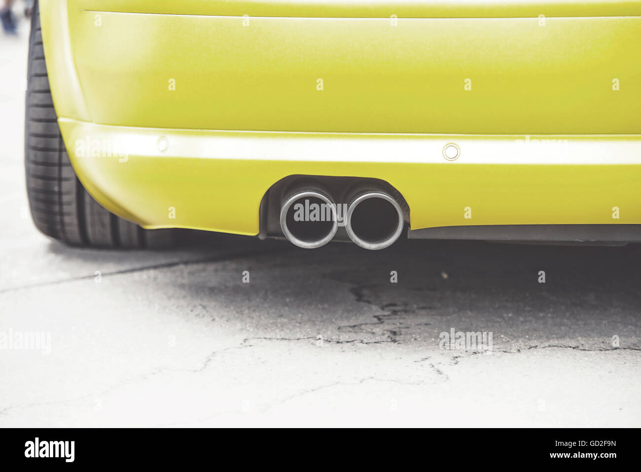 Double exhaust pipes of a modern sports car Stock Photo - Alamy