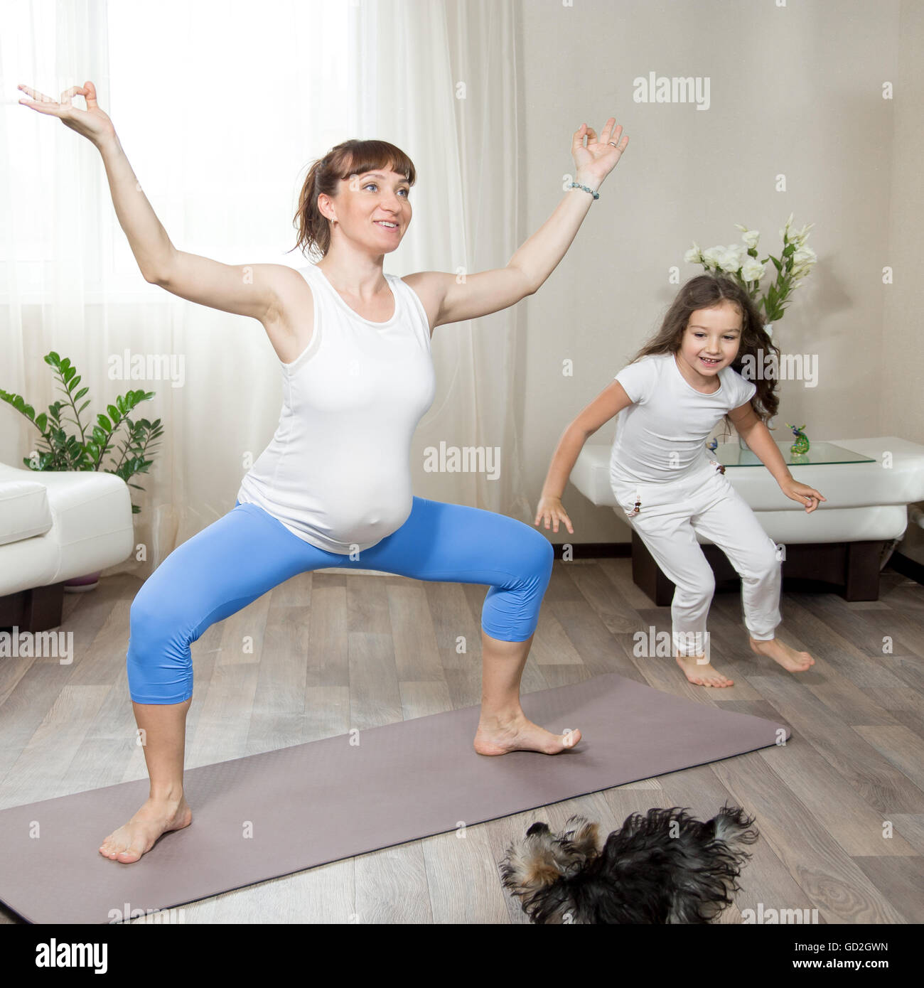 Family healthy lifestyle concept. Pregnancy Yoga and Fitness. Young ...