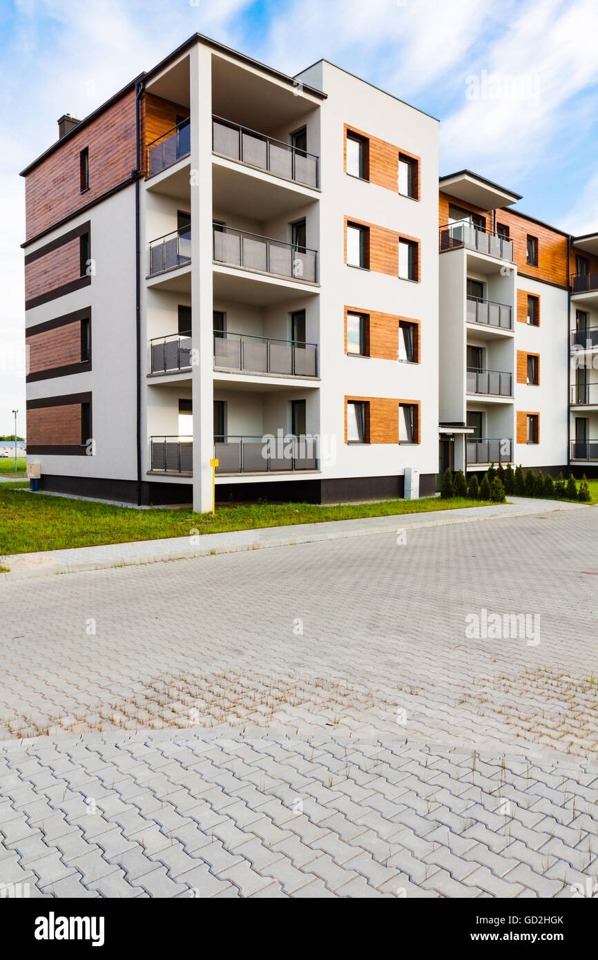 New multi-family block with balconies and bright facade decorated with ...