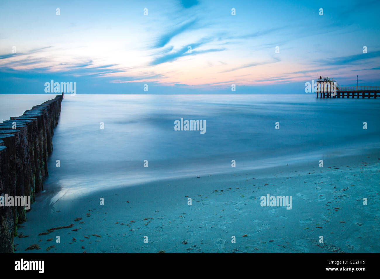 Sandy coastal beach sunrise pier background hi-res stock photography ...