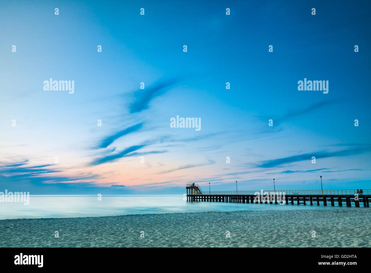 Sandy coastal beach sunrise pier background hi-res stock photography ...