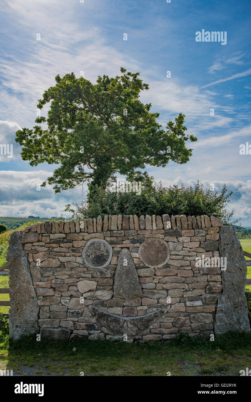 Smiley face built into new wall Stock Photo - Alamy