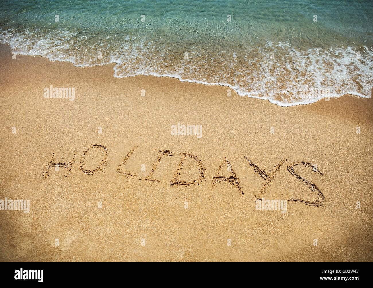 Happy Holidays! Written in sand at the beach. Holiday concept Stock ...