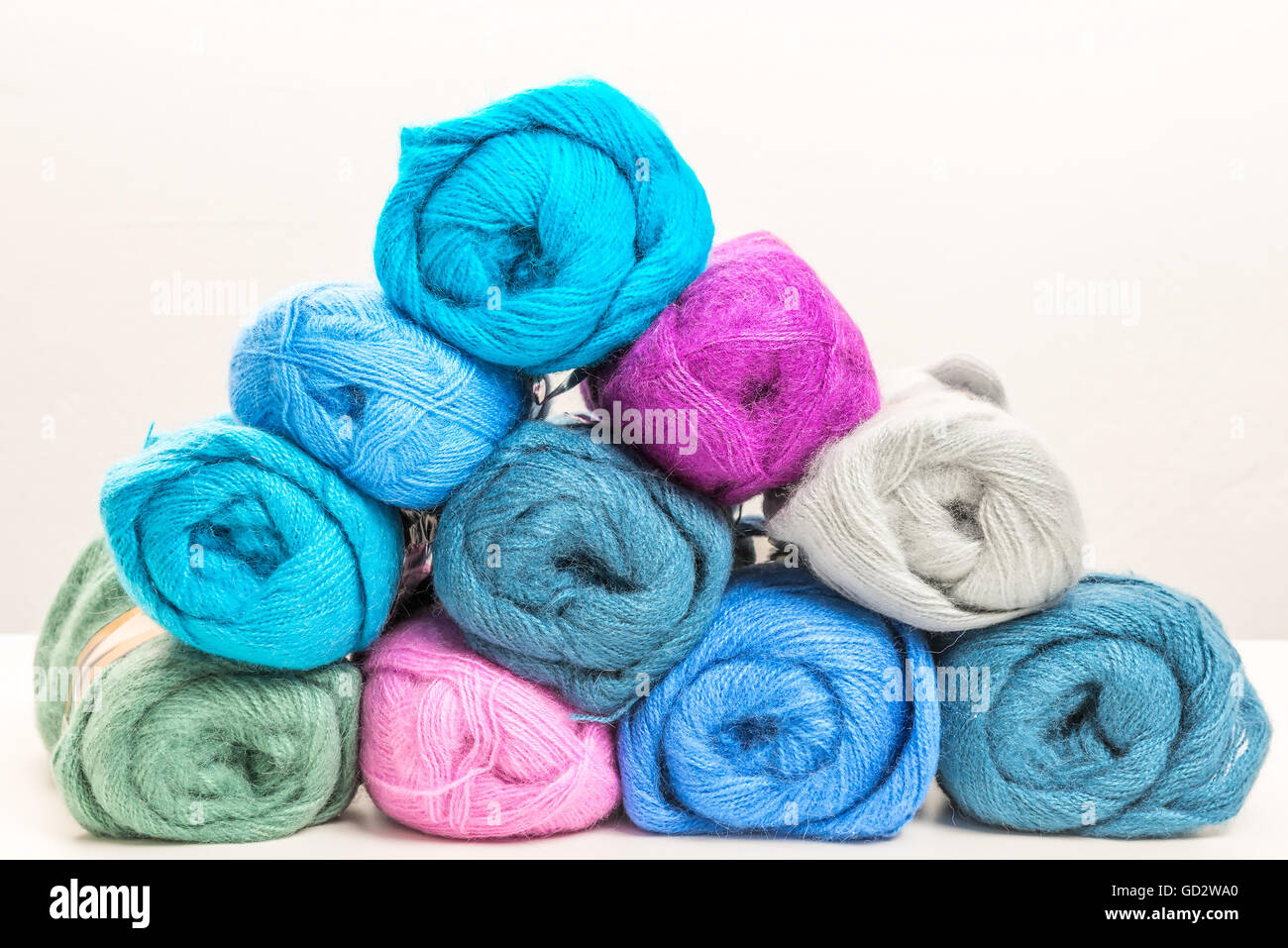 woolen thread lie in the shape of a pyramid on a white background Stock ...